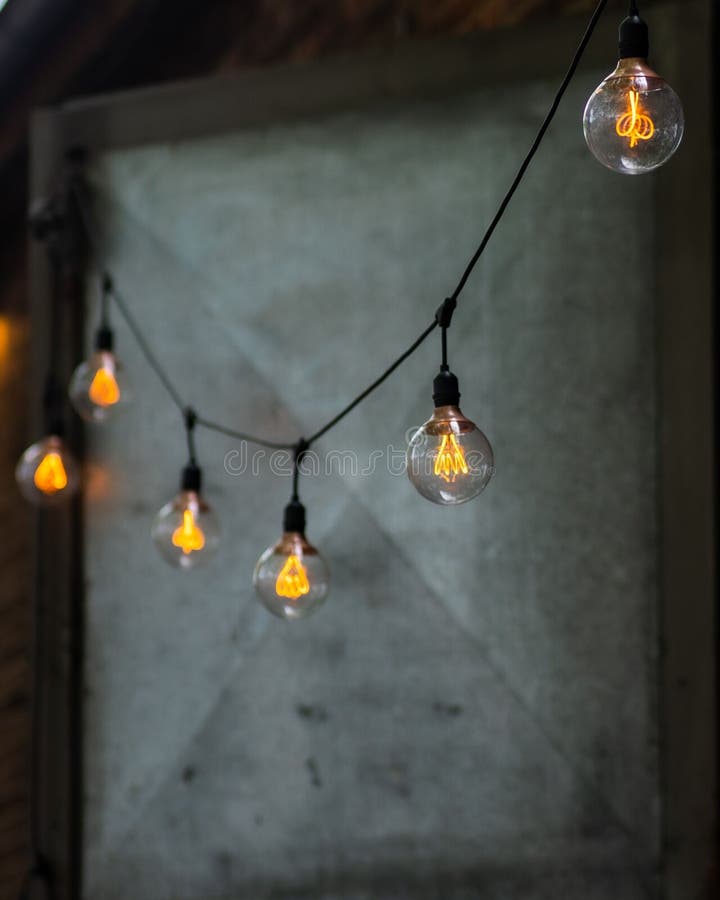 Vertical View of Decoration Lamps Hanging from a Wire before the Gray ...