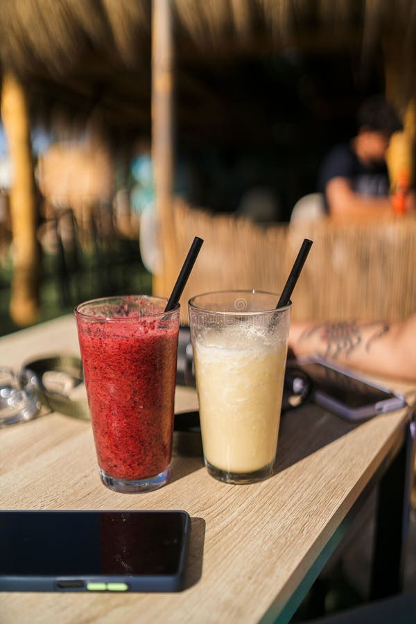 Vertical View of the Glasses of Red and White Cold Drinks on a Wooden ...