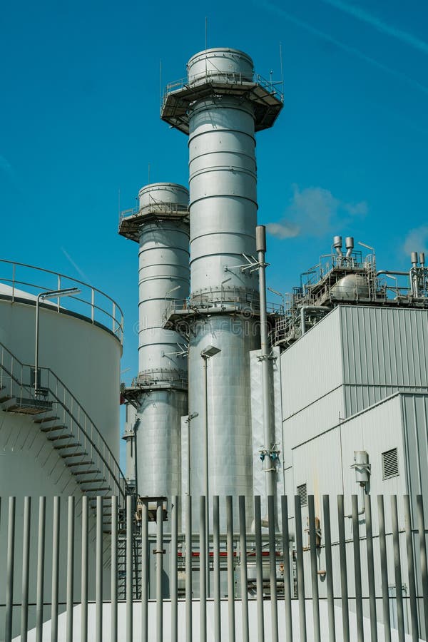 Vertical View of Industrial Facilities with Metallic Towers and ...