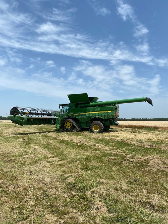 Vertical View of a John Deere Combine Harvester in the Field Under the ...