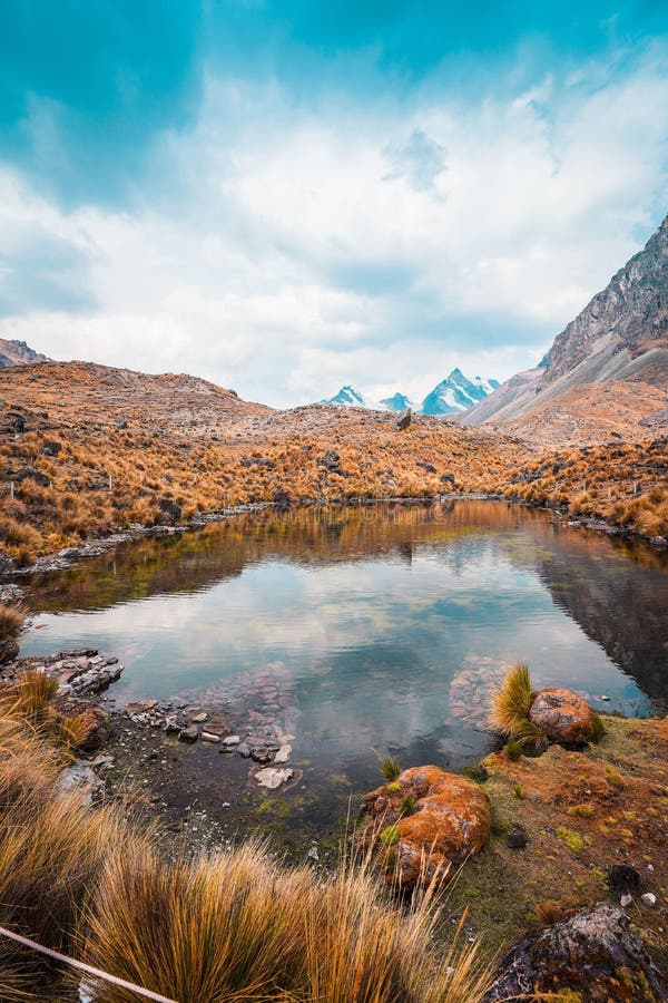 Vertical View of the Lake Under Nevado Auzangate Mountain in Peru with ...