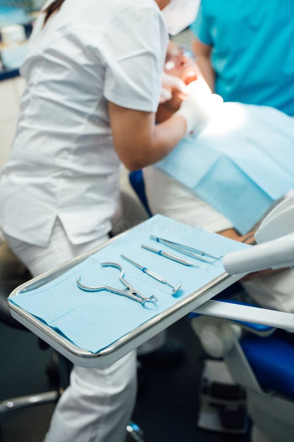 Vertical View of Nurses Healing the Teeth of the Client with Dental ...