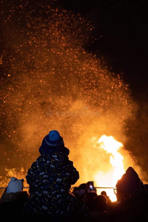 Vertical View of People Standing before a Bonfire at the Annual ...