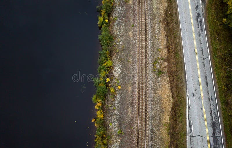 Vertical View of Railroad and Asphalt Road Side by Side at Shore Stock ...