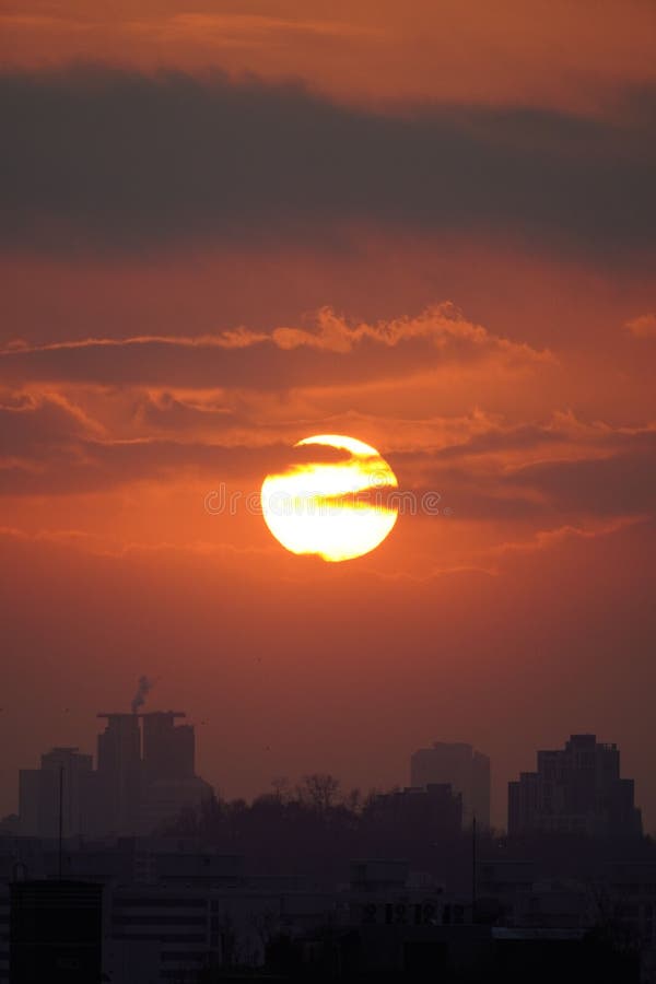Vertical View of a Reddish Sunset Over a City Stock Photo - Image of ...