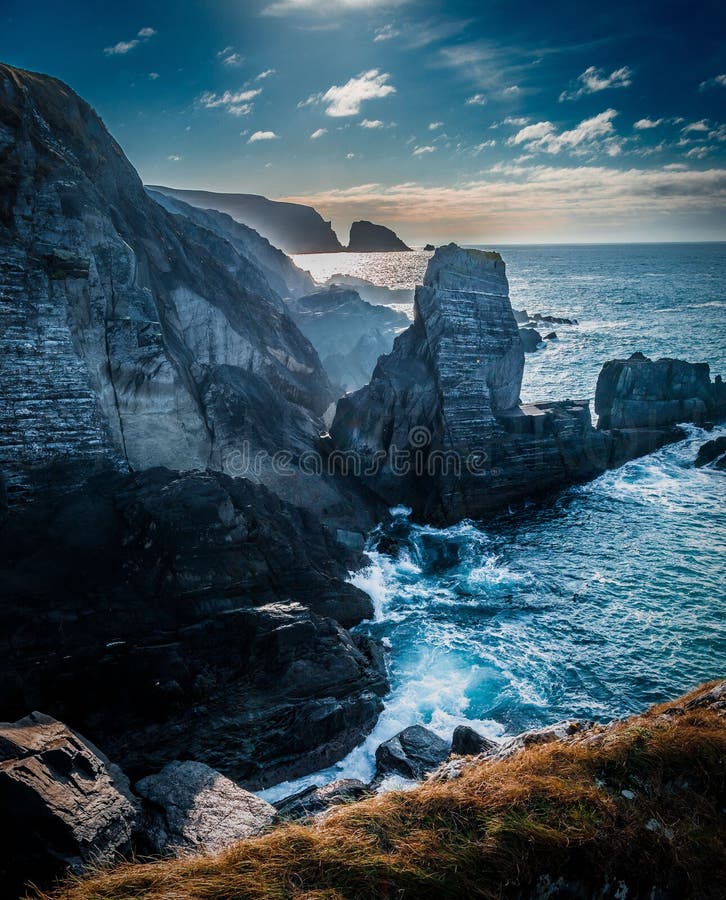 Vertical View of Rocky Cliffs on a Seashore in Ireland Stock Photo ...