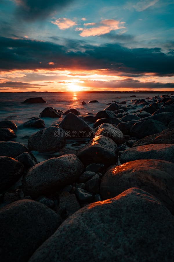 Vertical View of a Rocky Coast of an Ocean at Sunset Stock Photo ...