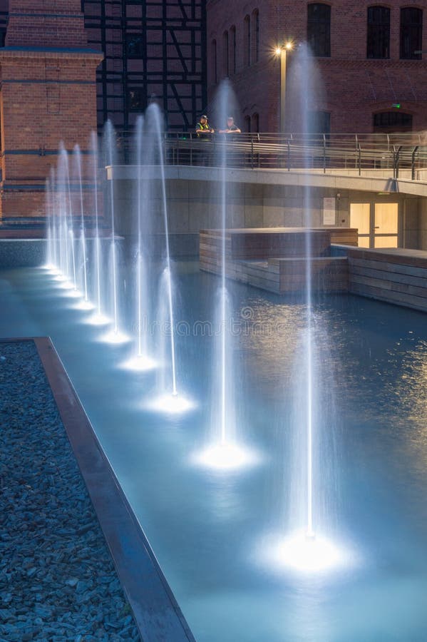 Vertical View on Row of White Water Fountains at Dusk Stock Image ...