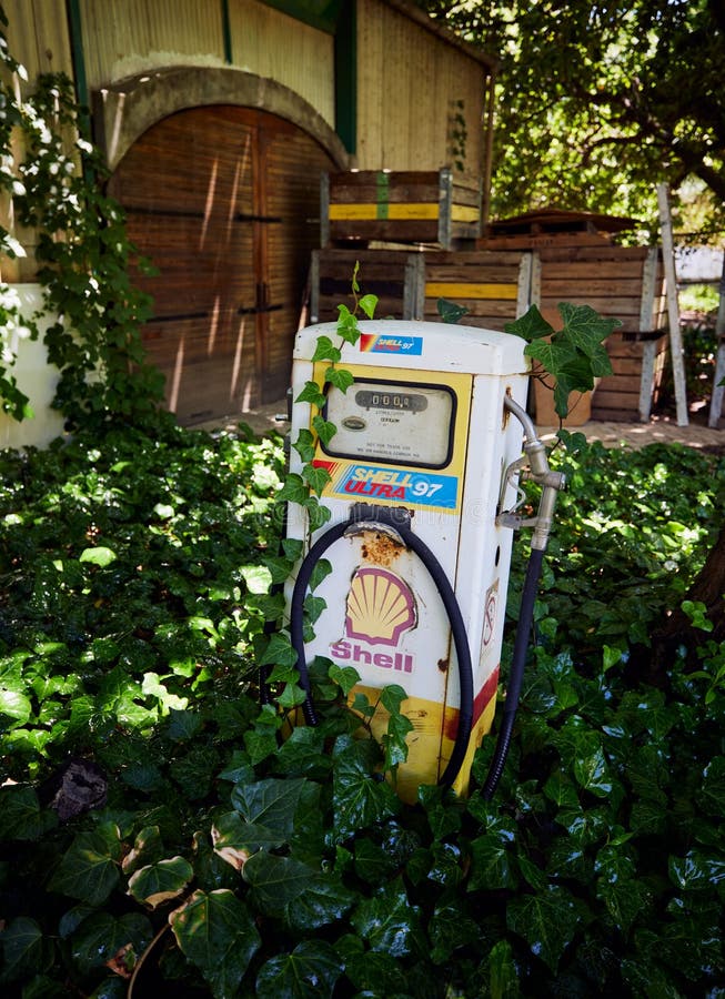 Vertical View of a Shell Fuel Dispenser in the Green Leaves Editorial ...