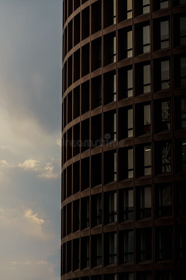 Vertical View of a Tall Building with Cylindrical Shape and Many ...