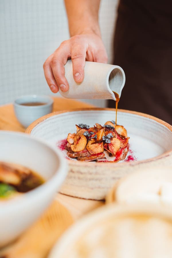 Vertical View of the Unknown Man Hand Pouring Maple Syrup on Baked ...