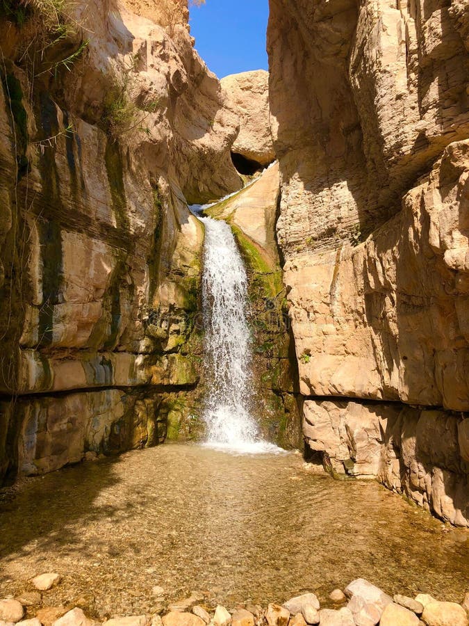 Vertical View of the Waterfall in the Cliffs of Ein Gedi Reserve on a Sunny Day Stock Photo ...