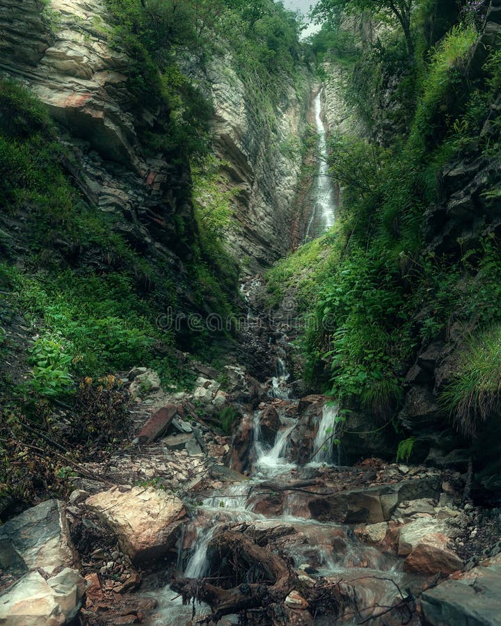 Vertical View of the Waterfall Flowing through the Stones Cascade Stock ...