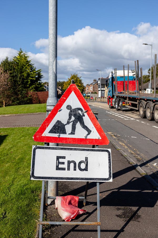 Vertical View of Well Used End of Roadwork Temporary Sign by the Side ...
