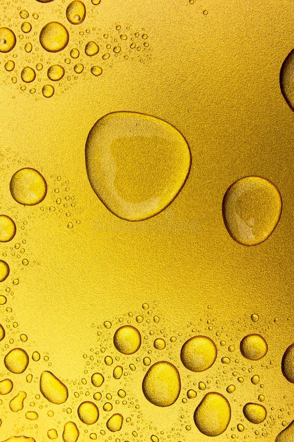 Vertical Water Drop on Gold Texture Background. Water Droplet on Gold ...
