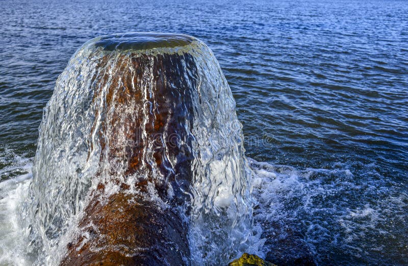 Vertical Water Flow from the Pipe To the Fish Pond Stock Photo - Image ...