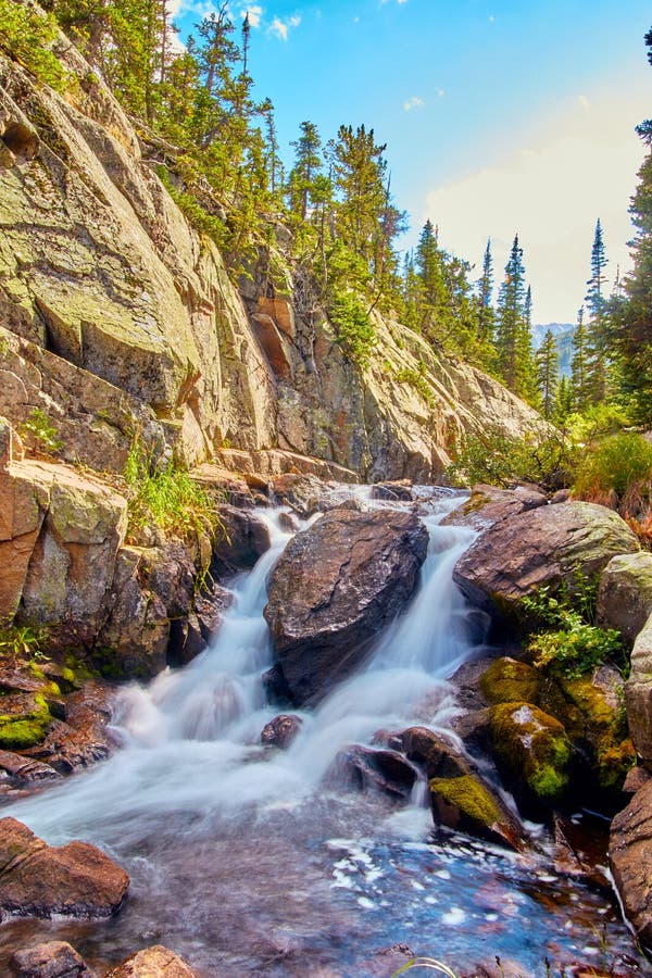 Vertical of Waterfall through Large Boulders in Mountains with Lichen ...