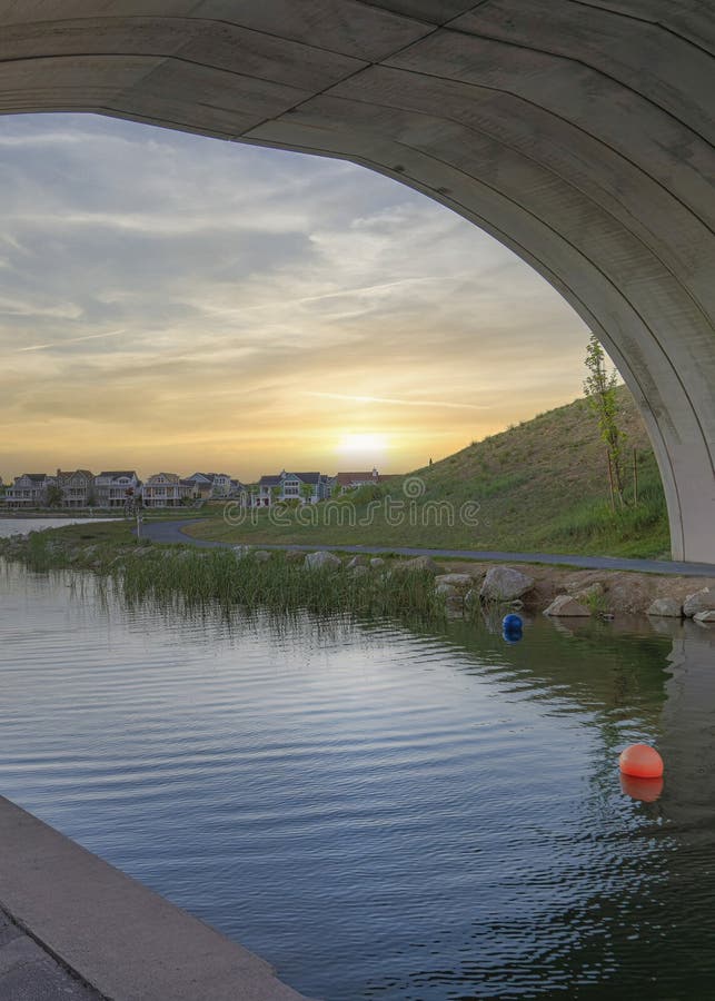 Vertical Whispy White Clouds Under an Arched Bridge Over Oquirrh Lake ...