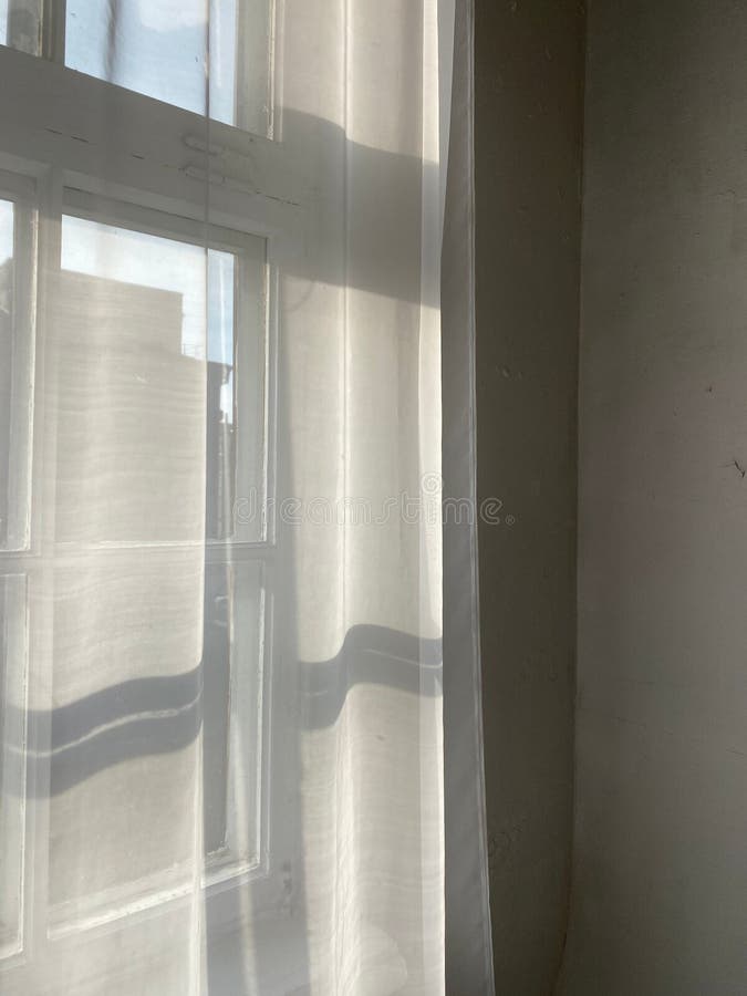Vertical of White Curtains Over a Wooden Window in Sunlight Stock Image ...