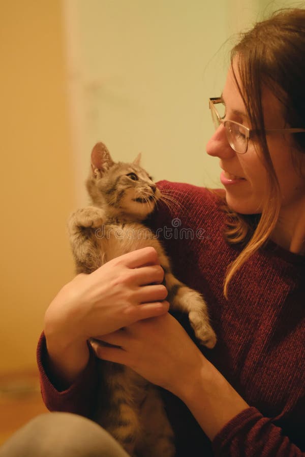Vertical of a Woman Holding a Cute Scared Kitty Stock Image - Image of ...