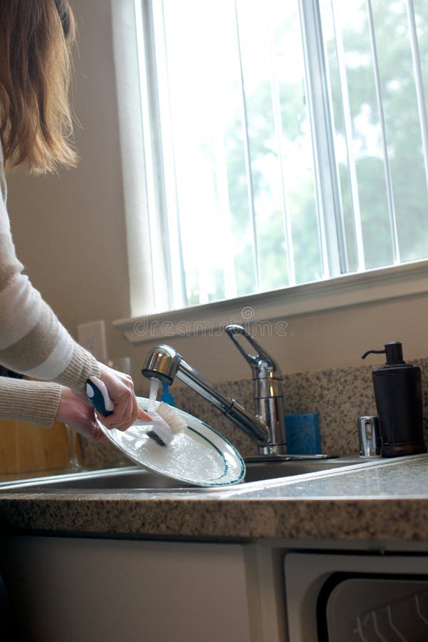 Vertical of Woman Scrubbing Plate Stock Image - Image of cleaning ...