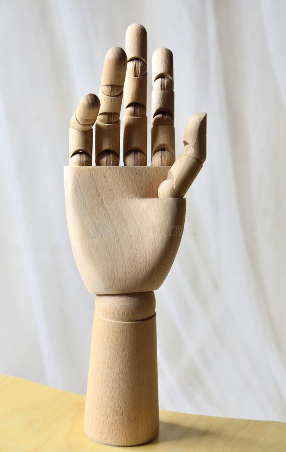 Vertical of a Wooden Mannequin Hand on a White Background Stock Image ...