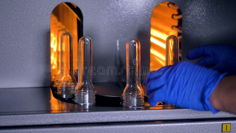 Vertically Installed PET Preforms Leave Pre-heating Chamber. Stock ...