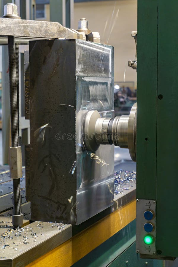 A Vertically Milling Machine with a Cnc Router Performs Grinding of a ...