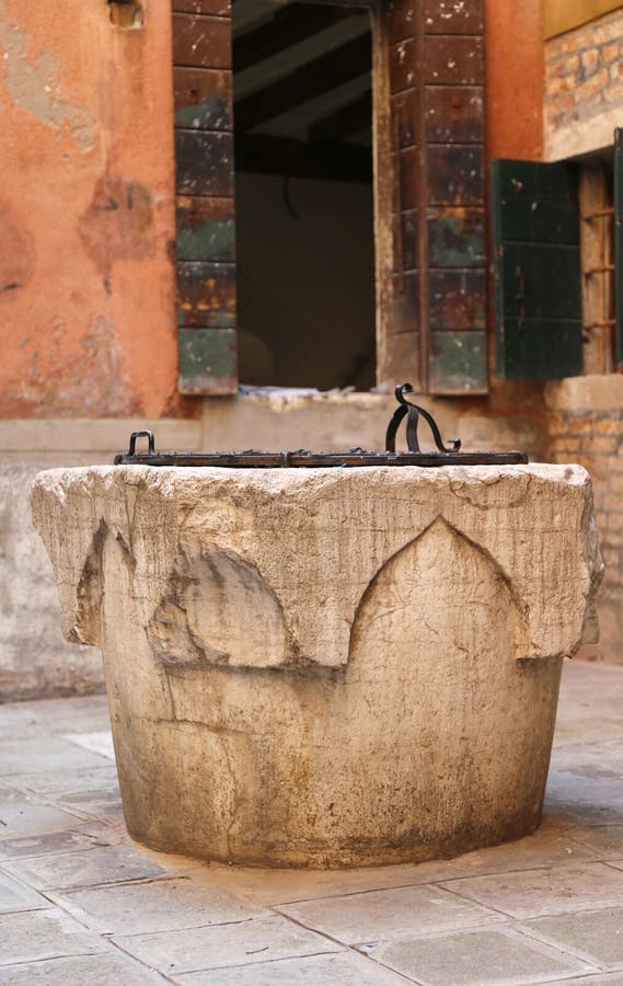 Ancient Stone Well in a Square of a European City Stock Photo - Image ...