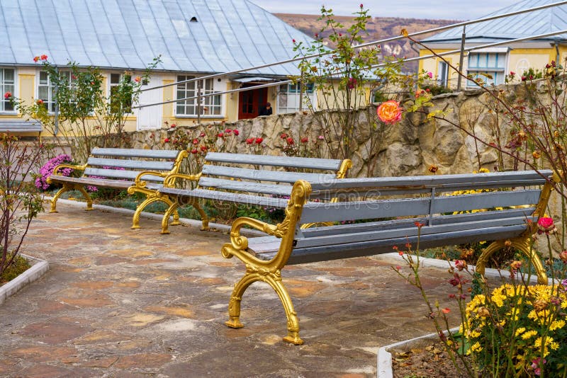 Very Beautiful Benches in a Rustic Setting with a Decorative Stone ...