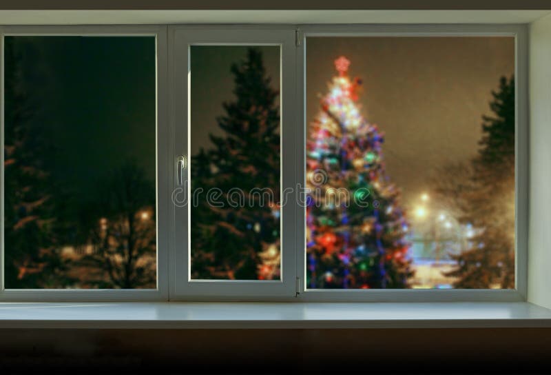 Christmas Tree and Snow-covered Christmas Trees Outside the Window ...