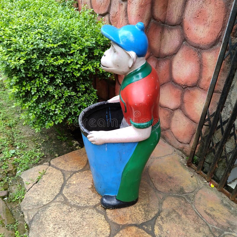 A Very Beautiful Statue Dustbin Stock Image - Image of grass, wall ...