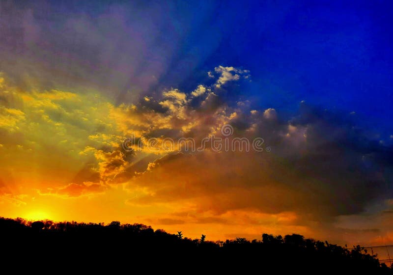 Very Beautiful Sunset Behind the Hills with Beautiful Firing Clouds Sky ...