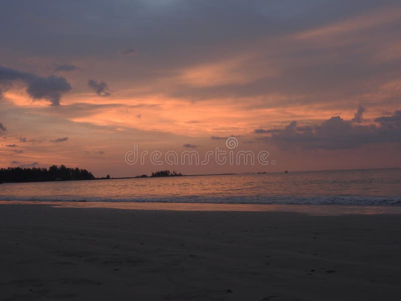 Sunset on the sandy beach stock image. Image of beauty - 107443063