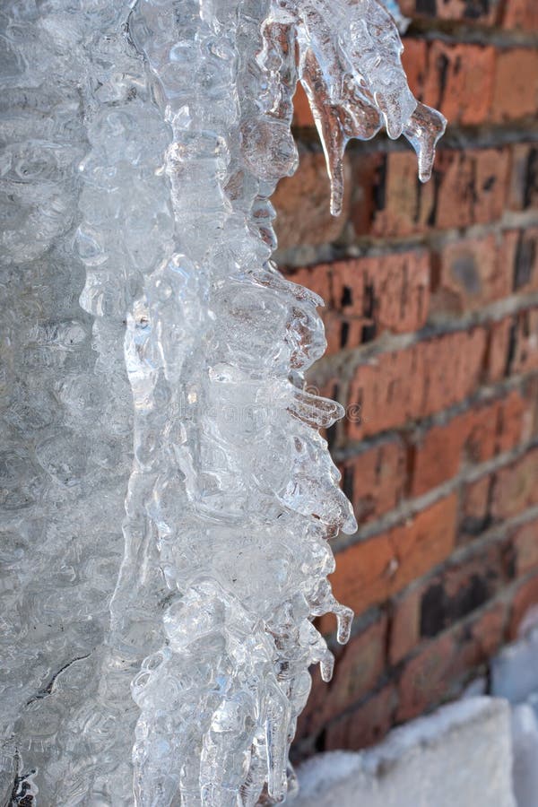 Very Beautiful Transparent Icicles and Ice Hang from the Drain Pipe ...