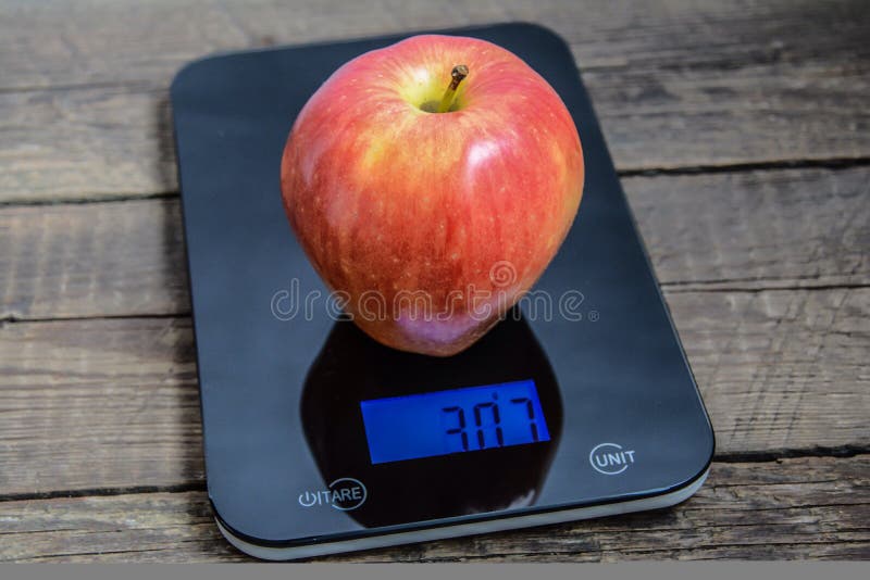 Very big apple on scales stock image. Image of vitamin - 48138057