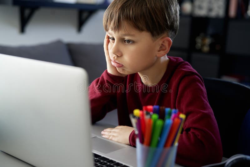 Close Up of Very Bored Boy during Remote Learning Stock Image - Image ...
