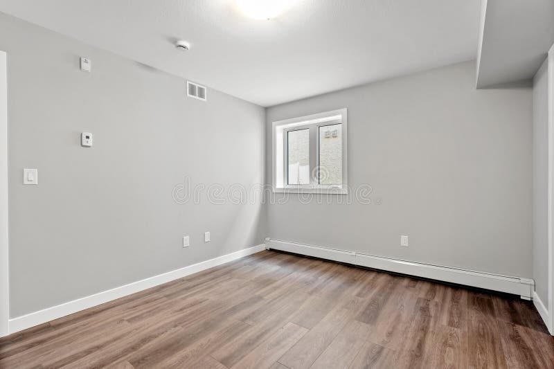 Very Clean and Empty Room with a Wooden Floor and a Window Stock Image ...