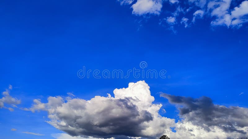 Very Clear Blue Sky with Single White Clouds Stock Image - Image of ...