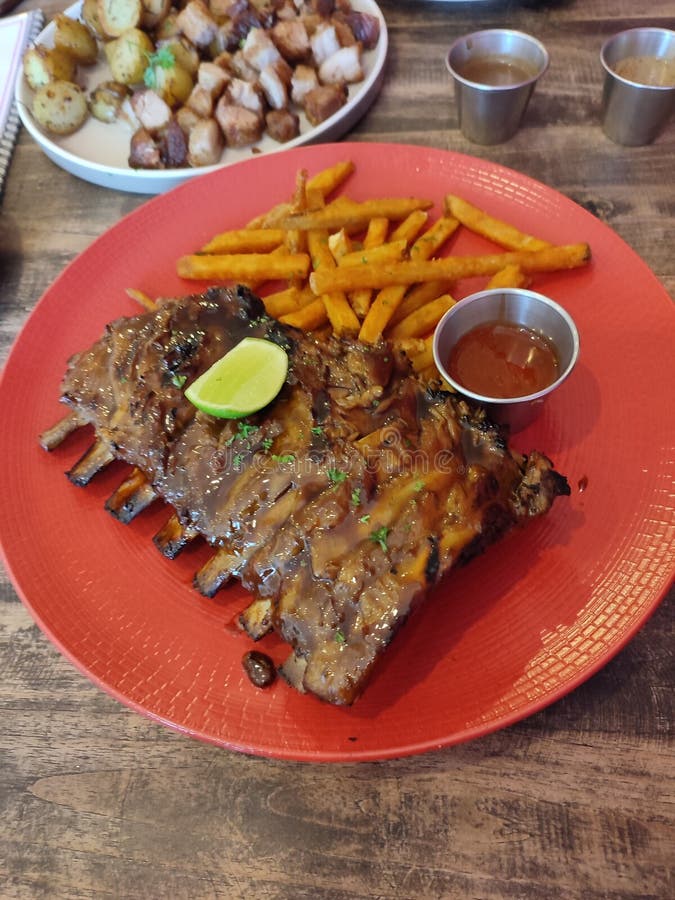 Very Delicious Pork Ribs and Potato Platters Stock Photo - Image of ...