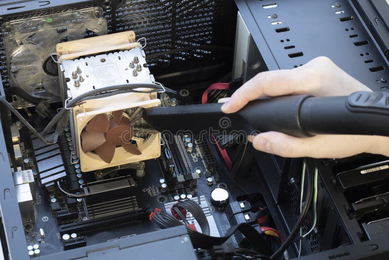 A Very Dirty Computer Fan Inside the Computer Being Cleaned with a ...