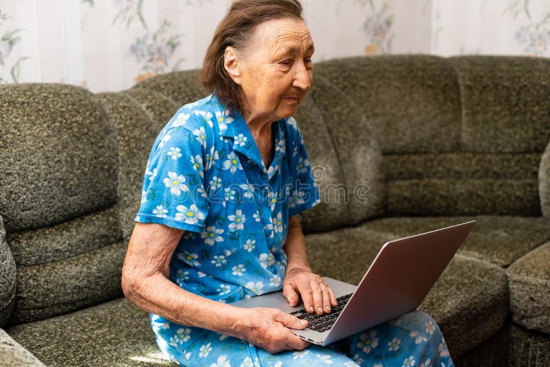 Very Old Woman Using Laptop Sitting in Her Sofa Stock Image - Image of ...