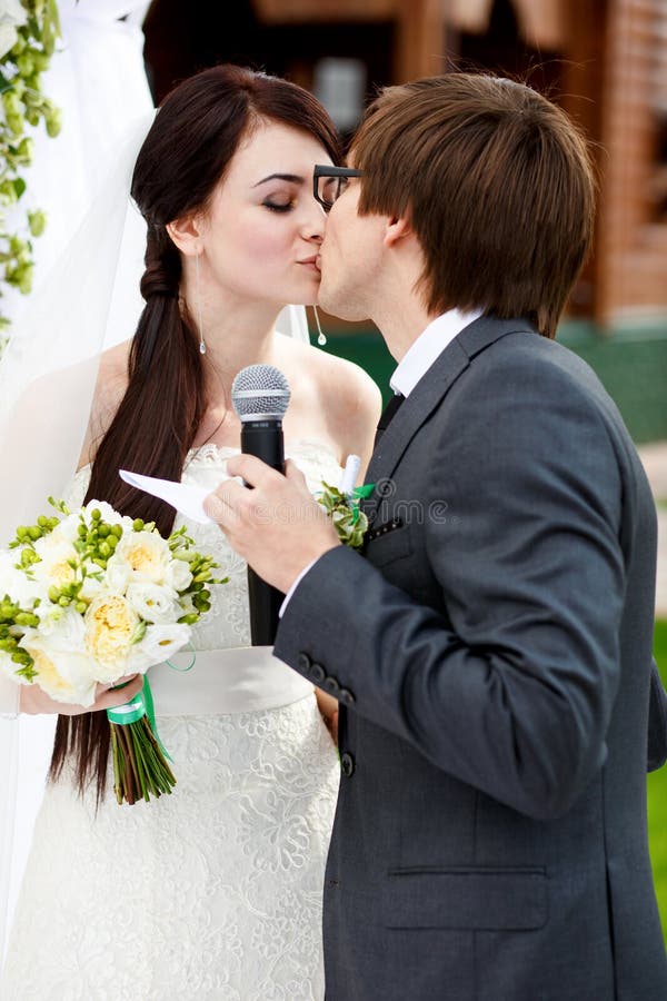 The Very First Kiss of Newlyweds after they Gave Oathes Stock Photo ...