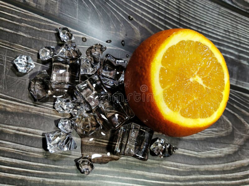 A Very Fresh Cut Orange with Ice Cubes Stock Photo - Image of shape ...