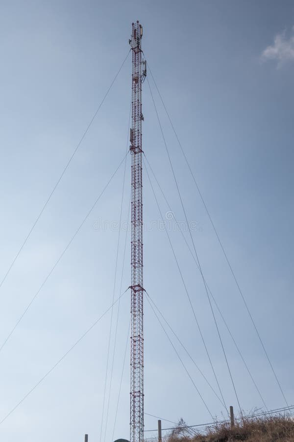 Very High Mobile Tower Against the Blue Sky Stock Image - Image of ...