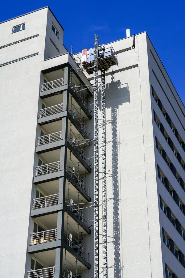 A Very High Self Propelled Freight Elevator Attached To the Facade of a ...