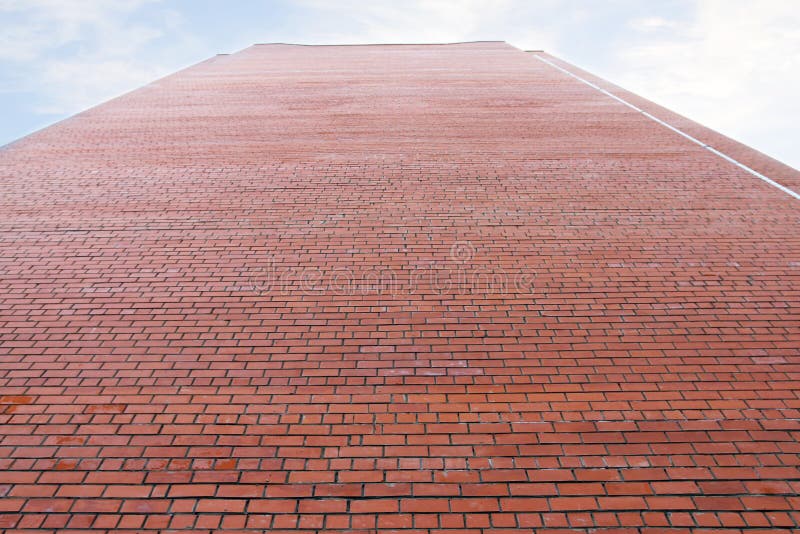 Very High Wall of Red Brick Building and Cloudy Sky Stock Image - Image ...
