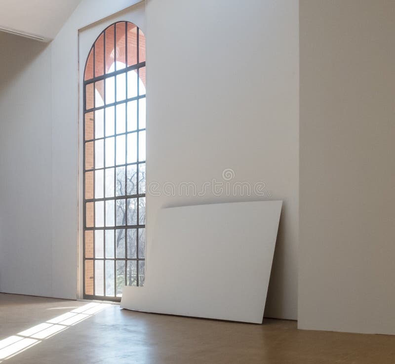 Very High White Wall with a Large Window that Ends in the Shape of an ...