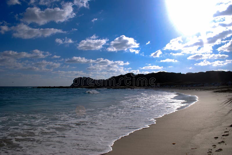 Sunny day on the beach stock photo. Image of horizon - 111514154