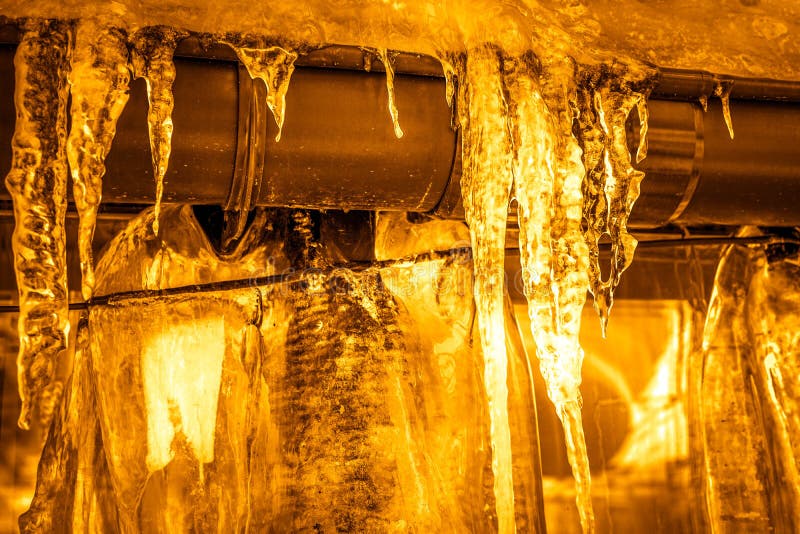 Very Large Icicles Close Up Photo Stock Image - Image of golden, bright ...